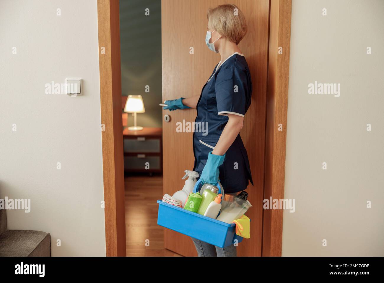 Woman holds box cleaning supplies hi-res stock photography and images ...