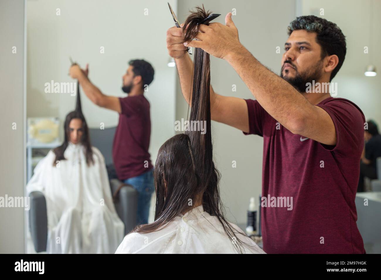 Hairdresser separating hair client hi-res stock photography and images ...