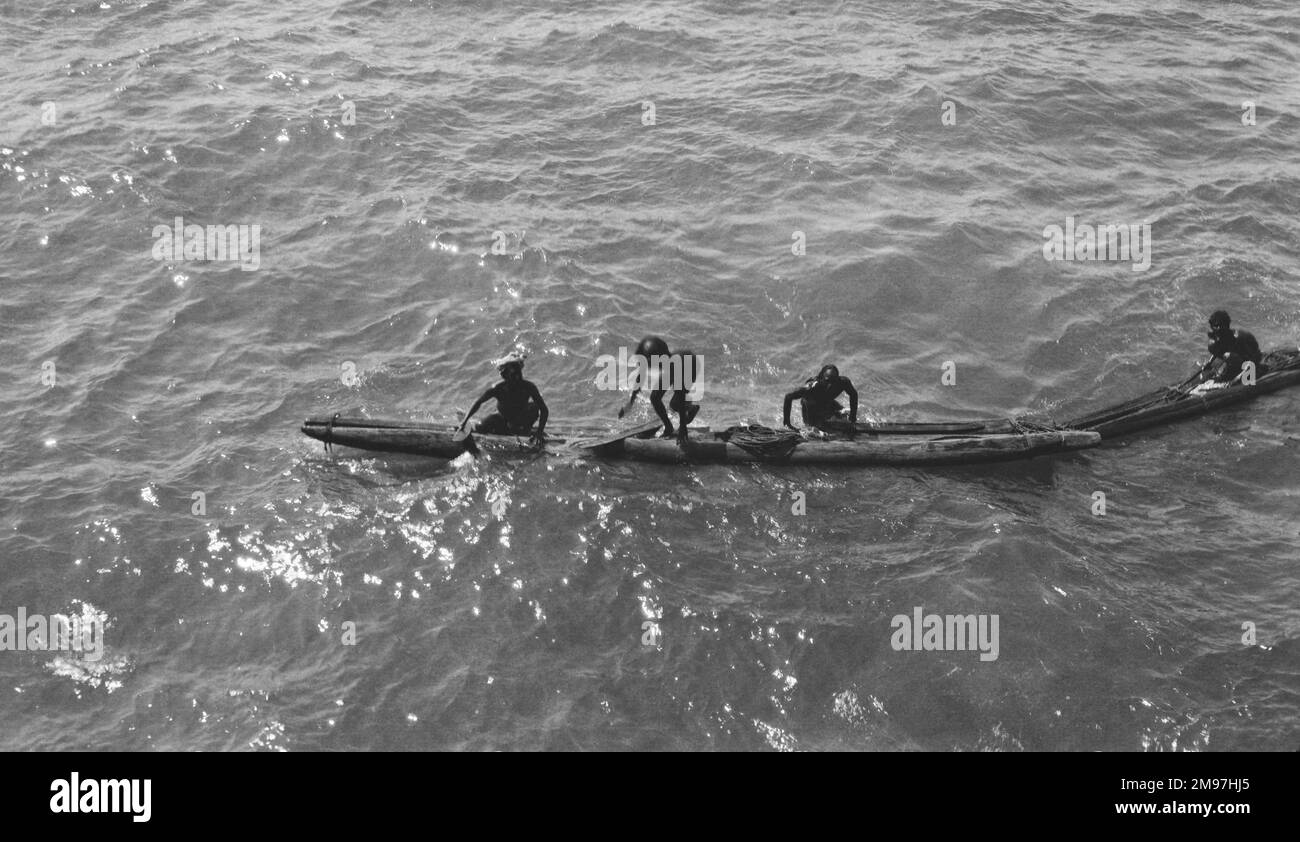 Native boatmen with canoes Stock Photo - Alamy