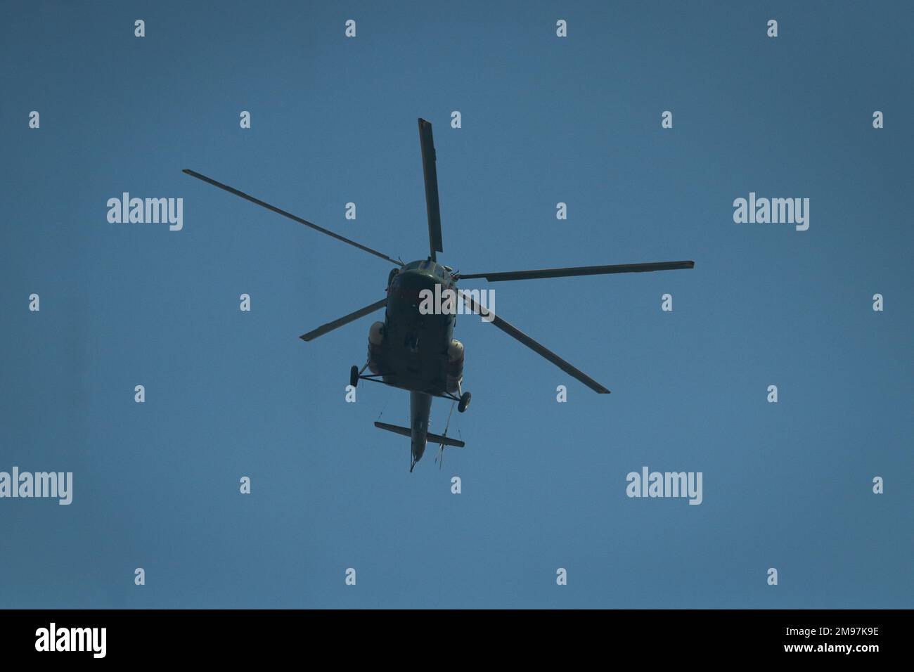 A military helicopter brings one of the "Yeti Airplane" crash victims ...