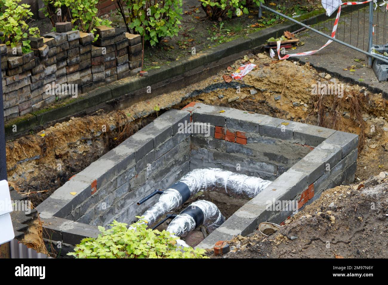Underground distribution chamber for district heating pipes open for ...