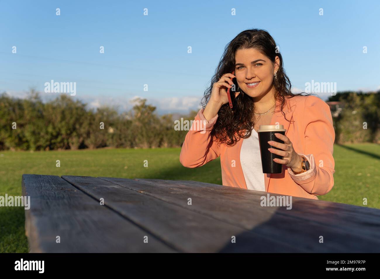 Pretty businesswoman sitting on hi-res stock photography and images - Alamy
