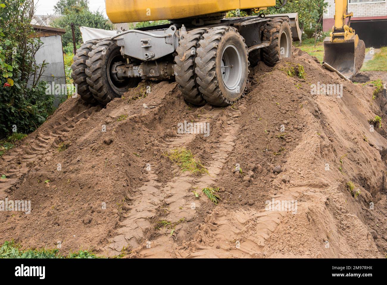 Traces from tire tread on the back of industrial transport excavator or ...