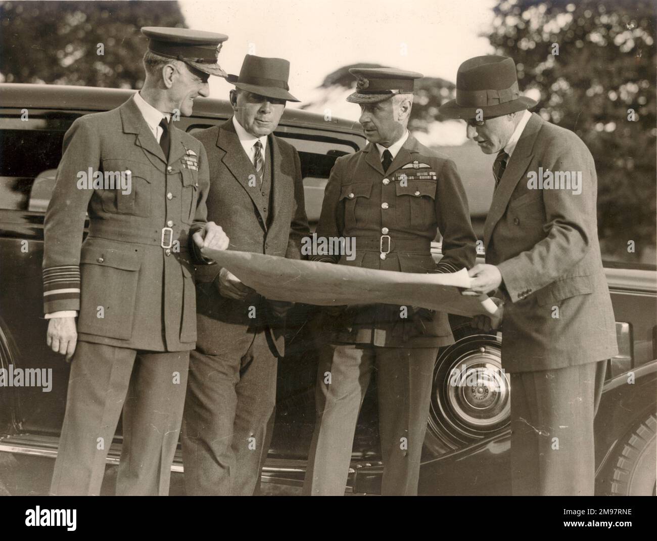 Uxbridge aerodrome prior to an air exercise. c.1937. From left: Sir ...
