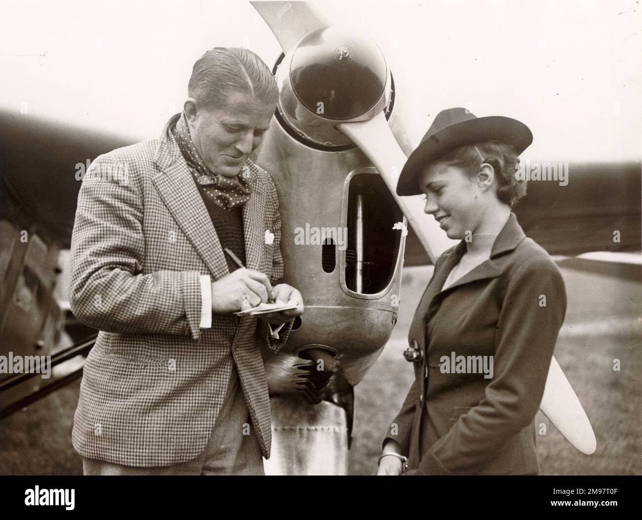 Flt Lt Tommy Rose, DFC (1895-1968) signs an autograph for Miss Gogo ...