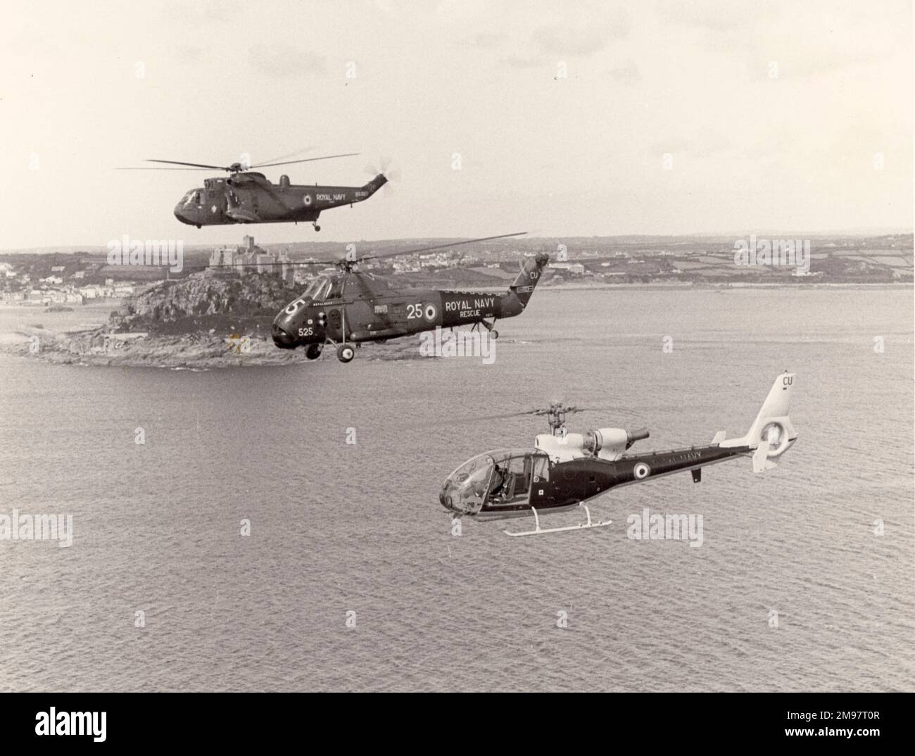 Three Royal Navy helicopters alongside St Michael’s Mount, Cornwall ...