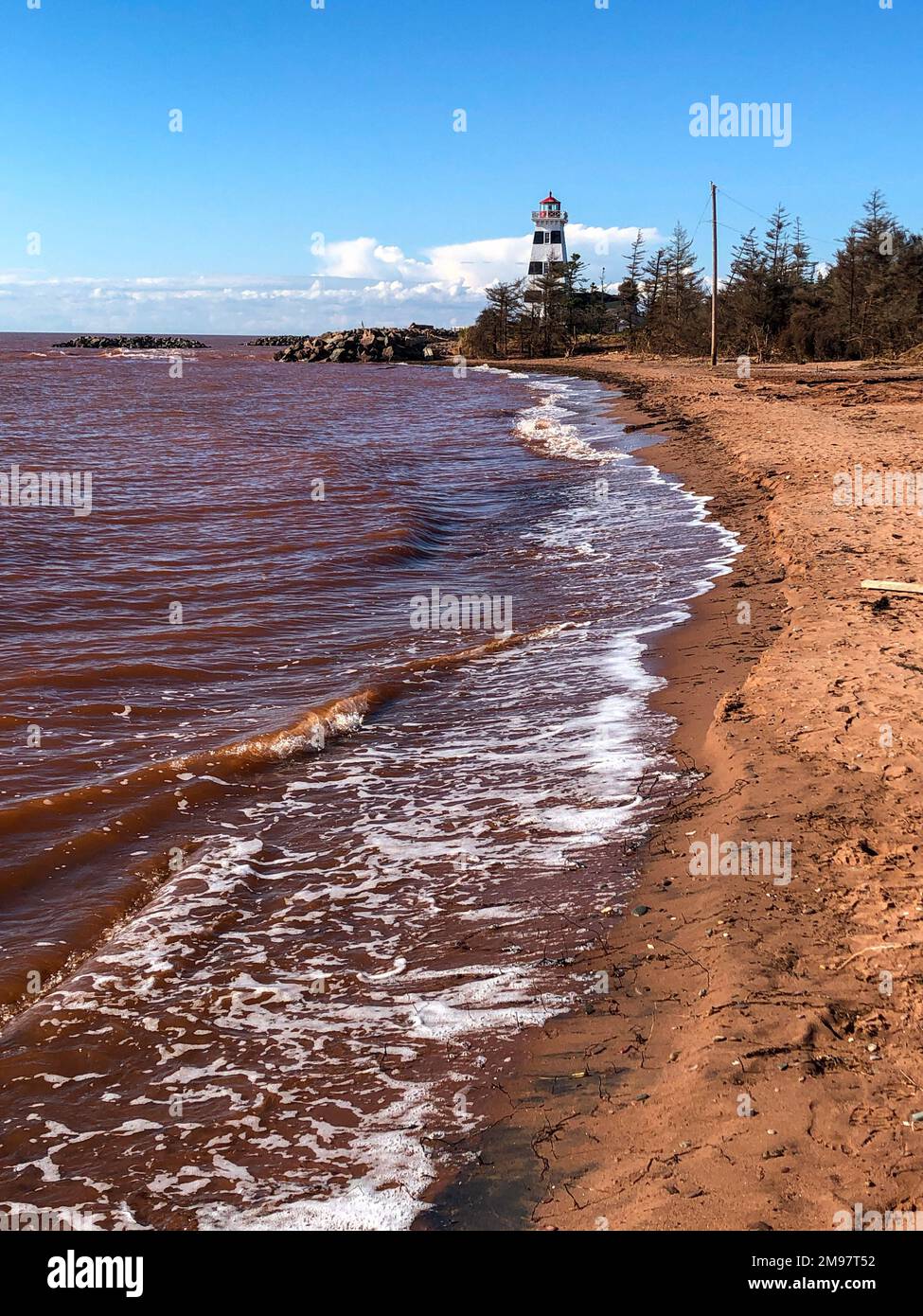 West Point Lighthouse and red ocean after a hurricane, Cedar Dunes ...