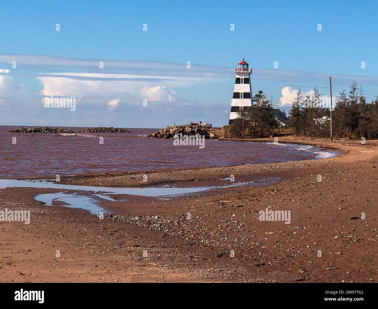 West Point Lighthouse and red ocean after a hurricane, Cedar Dunes ...