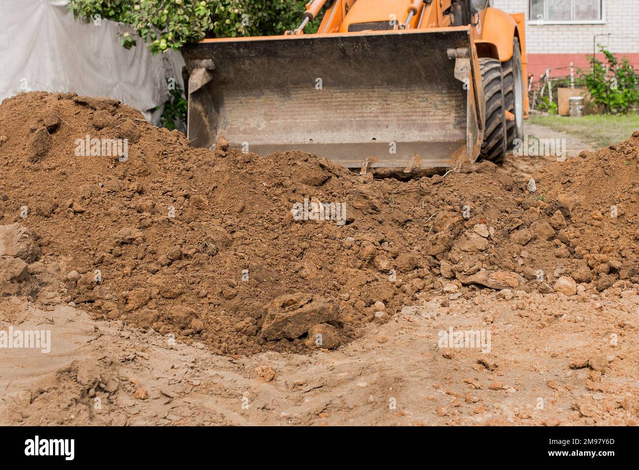 Tractor bucket level soil in hi-res stock photography and images - Alamy