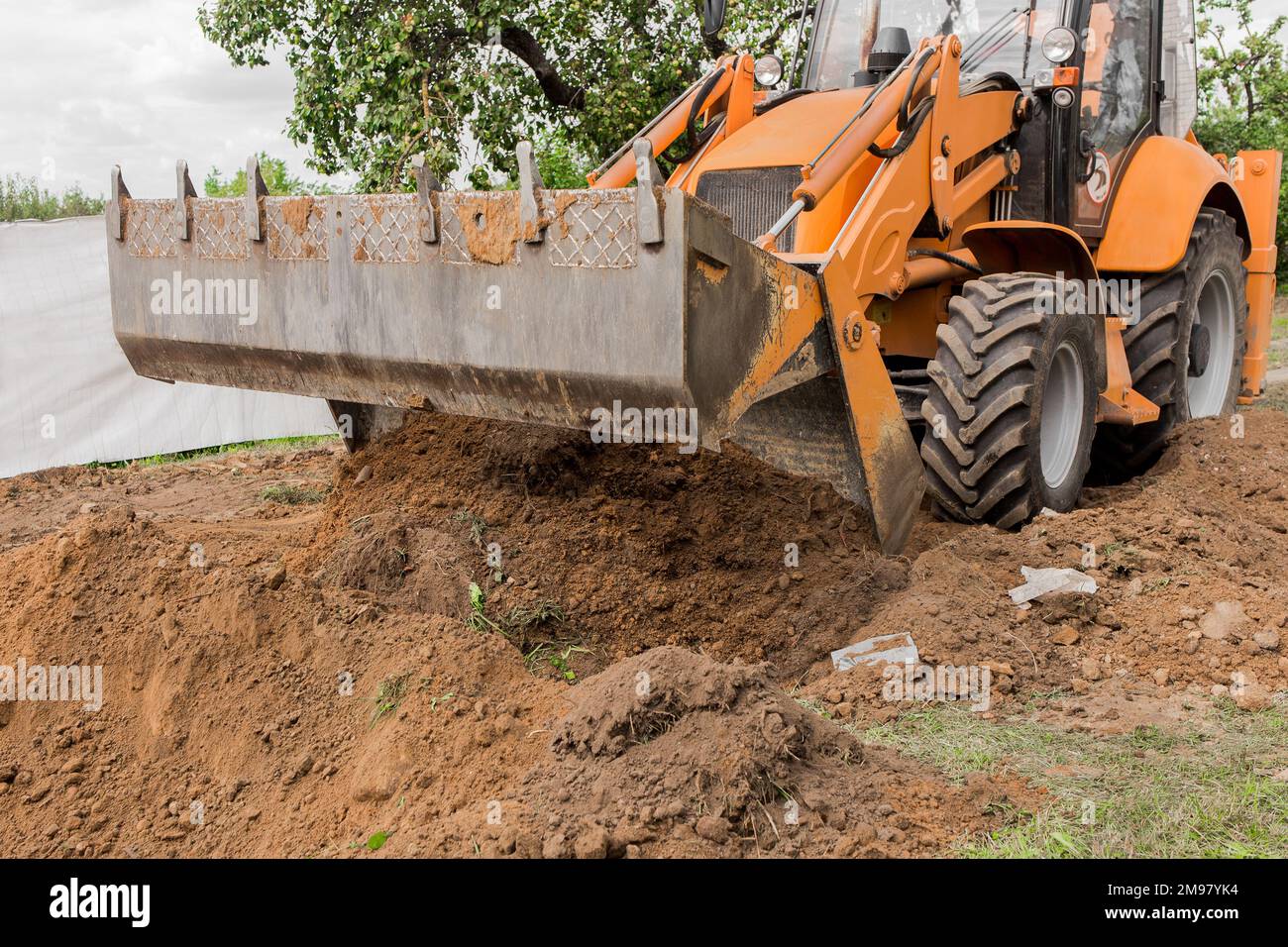 Tractor bucket level soil in hi-res stock photography and images - Alamy