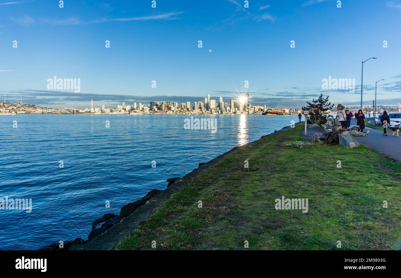The sun reflects from buildings in the skyline of Seattle, Washington ...