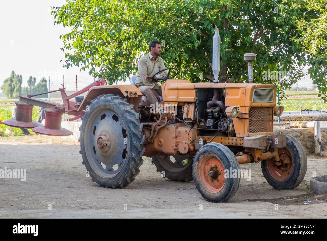 BAHAR, IRAN - JULY 13, 2019: Local farmer on his tractor near Bahar ...