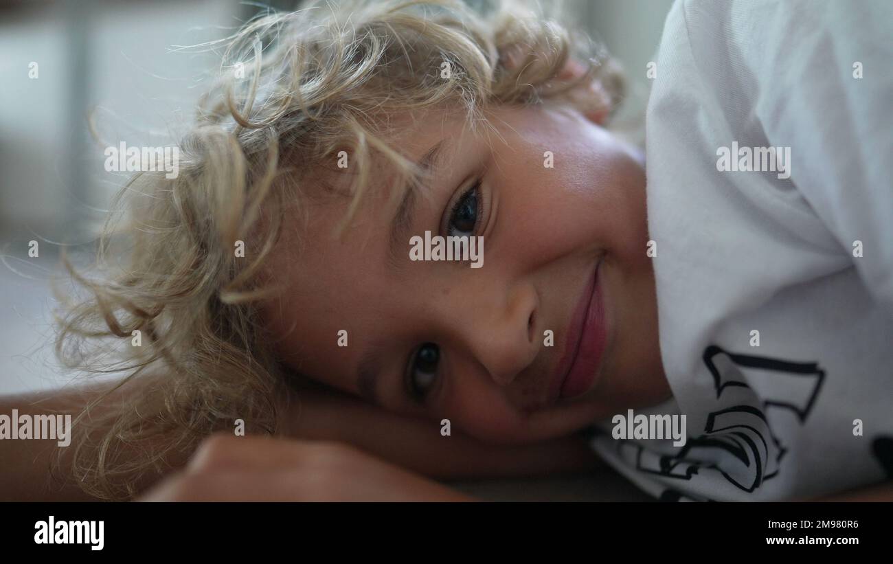 Handsome child young boy looking at camera smiling Stock Photo - Alamy