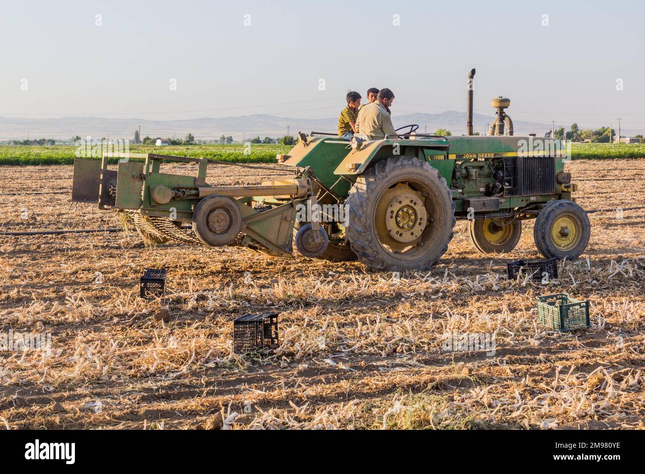 BAHAR, IRAN - JULY 13, 2019: Farmer family on their tractor near Bahar ...
