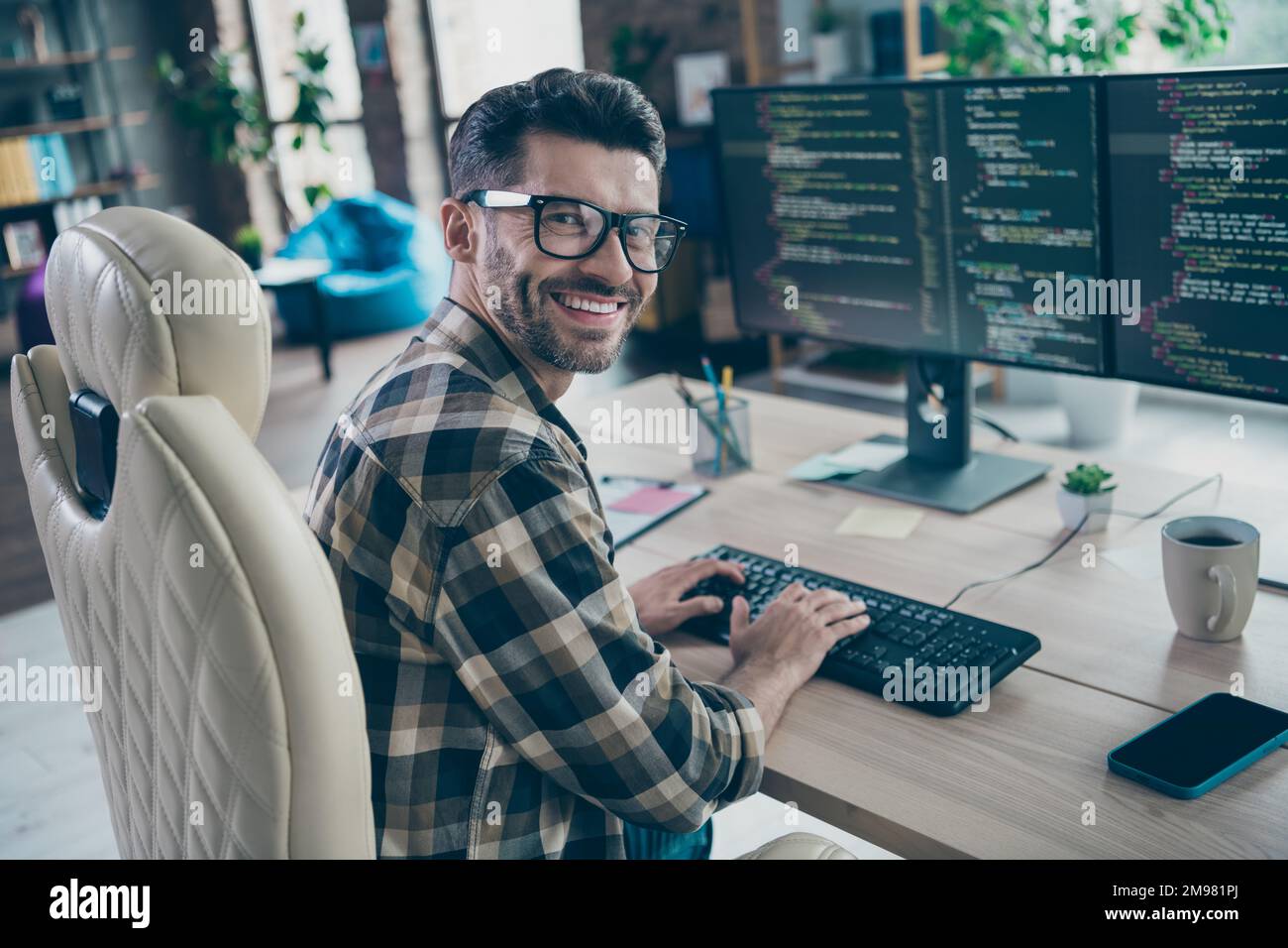 Profile photo of clever positive hardware expert man sitting chair ...