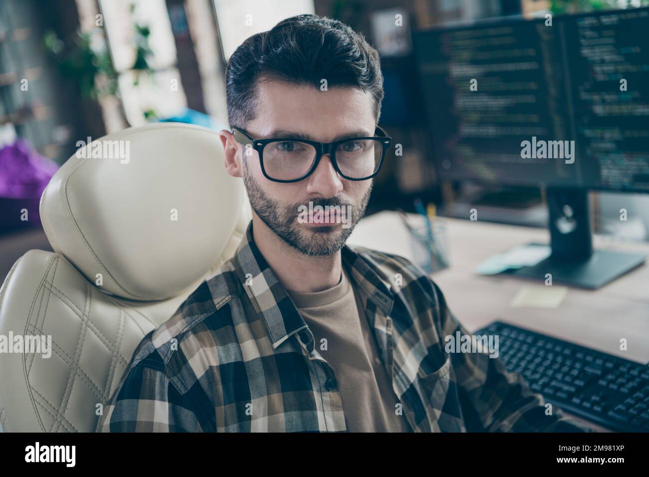Photo of serious concentrated cybersecurity expert man sitting leather ...