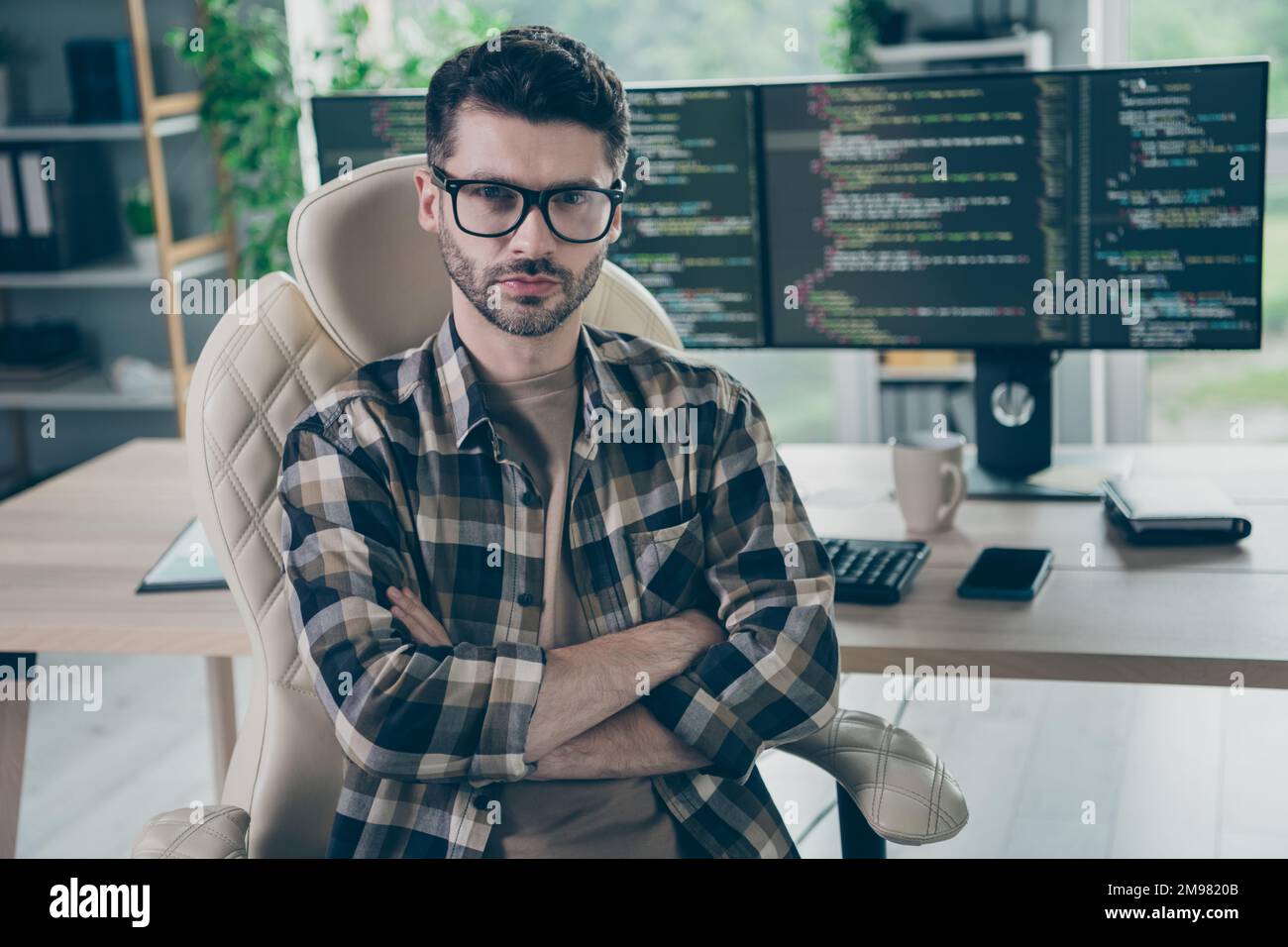 Photo of serious focused web designer guy sitting chair crossed arms ...