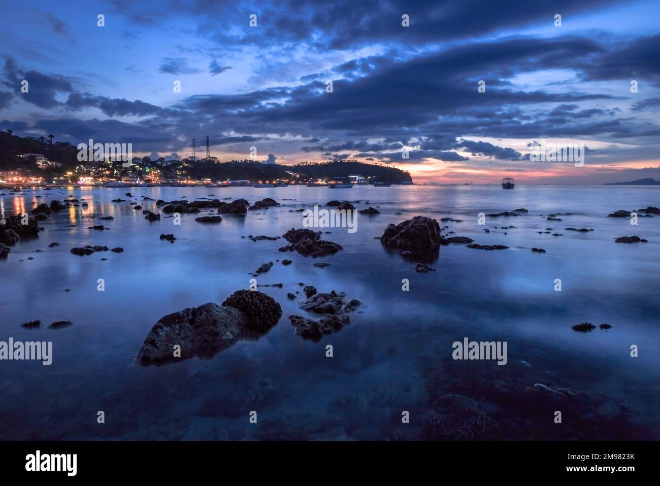 Coastal rocky beach landscape at sunset, Batangas, Calabarzon ...