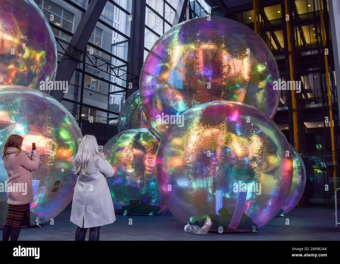 London, UK. 17th January 2023. People take photos of the giant ...