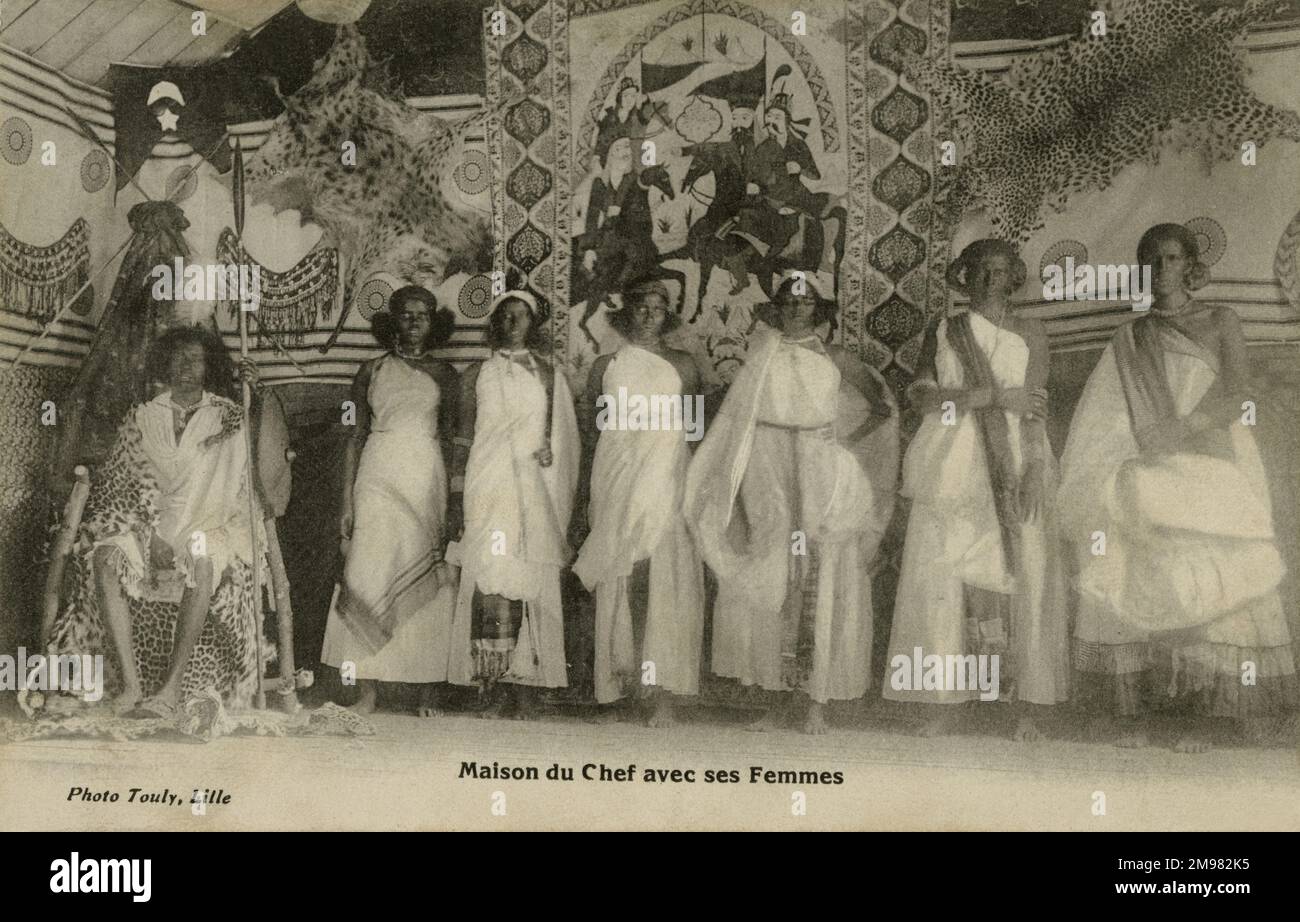 Tribal chief sits while his six wives stand next to him, North Africa ...