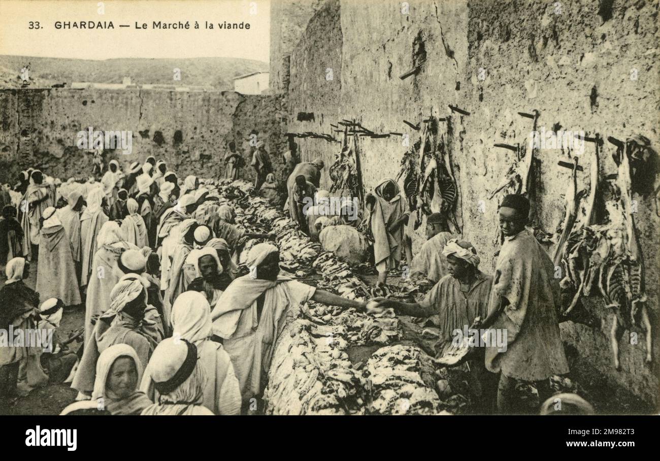 Customers and merchants exchange money and goods at the meat market in ...