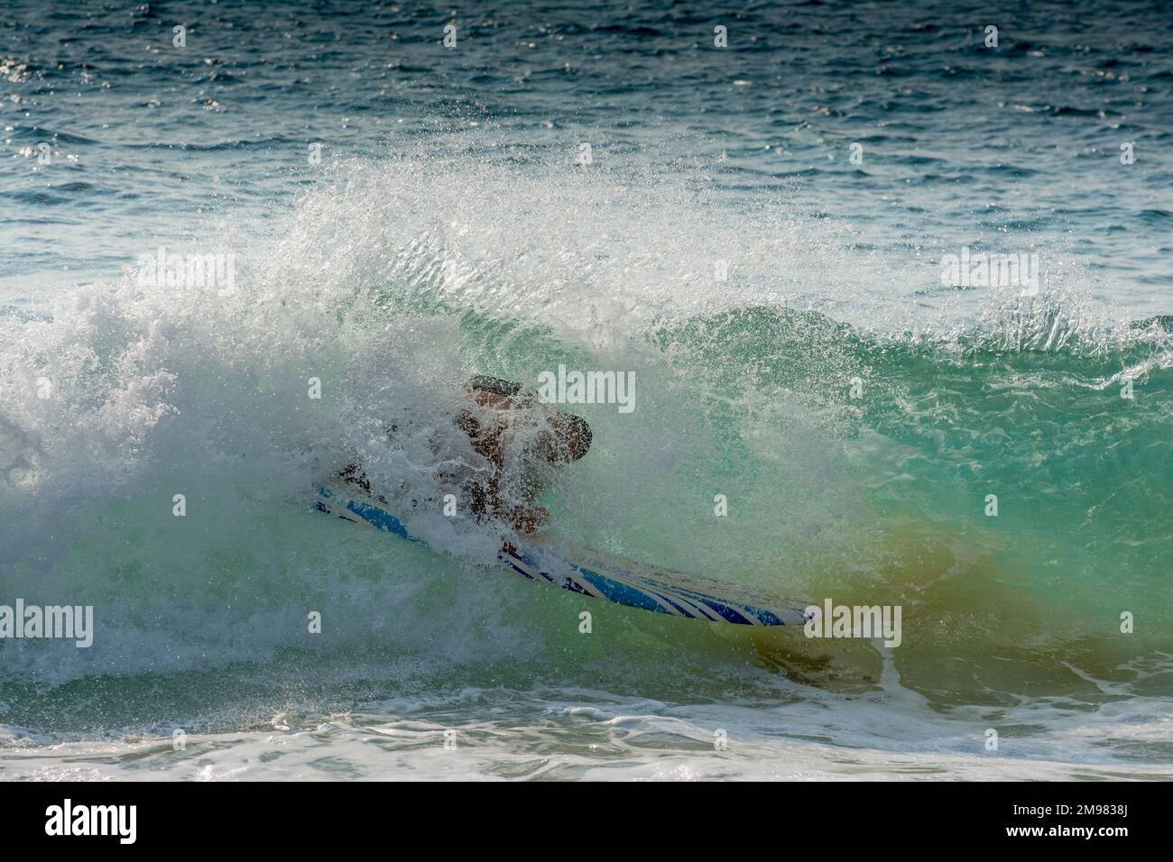 Surfer falling off surfboard hi-res stock photography and images - Alamy