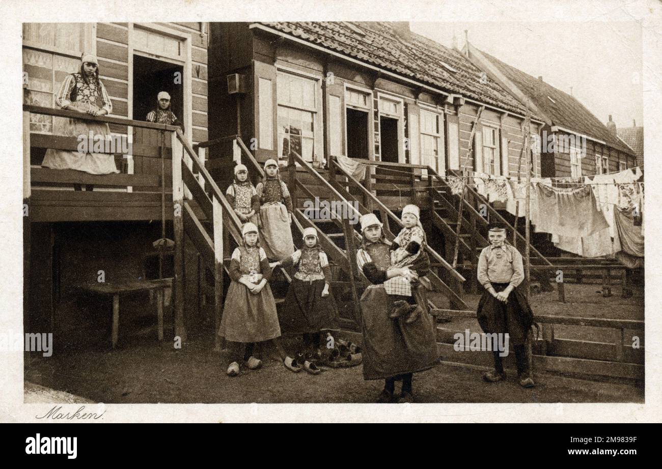 Large dutch family outside their wooden home at Marken, The Netherlands ...