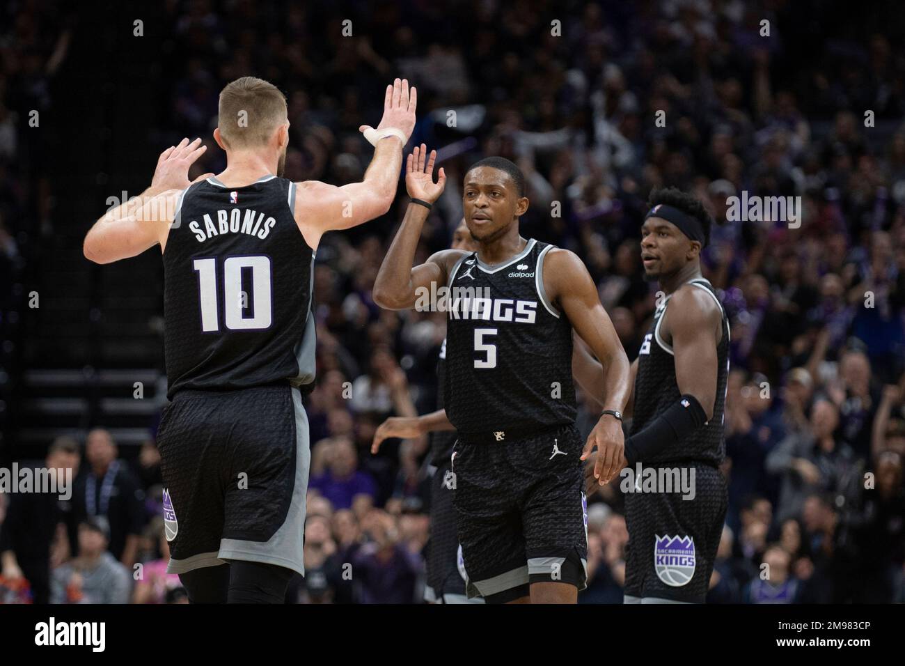 Sacramento Kings forward Domantas Sabonis (10) is met by teammate Sacramento Kings guard De ...