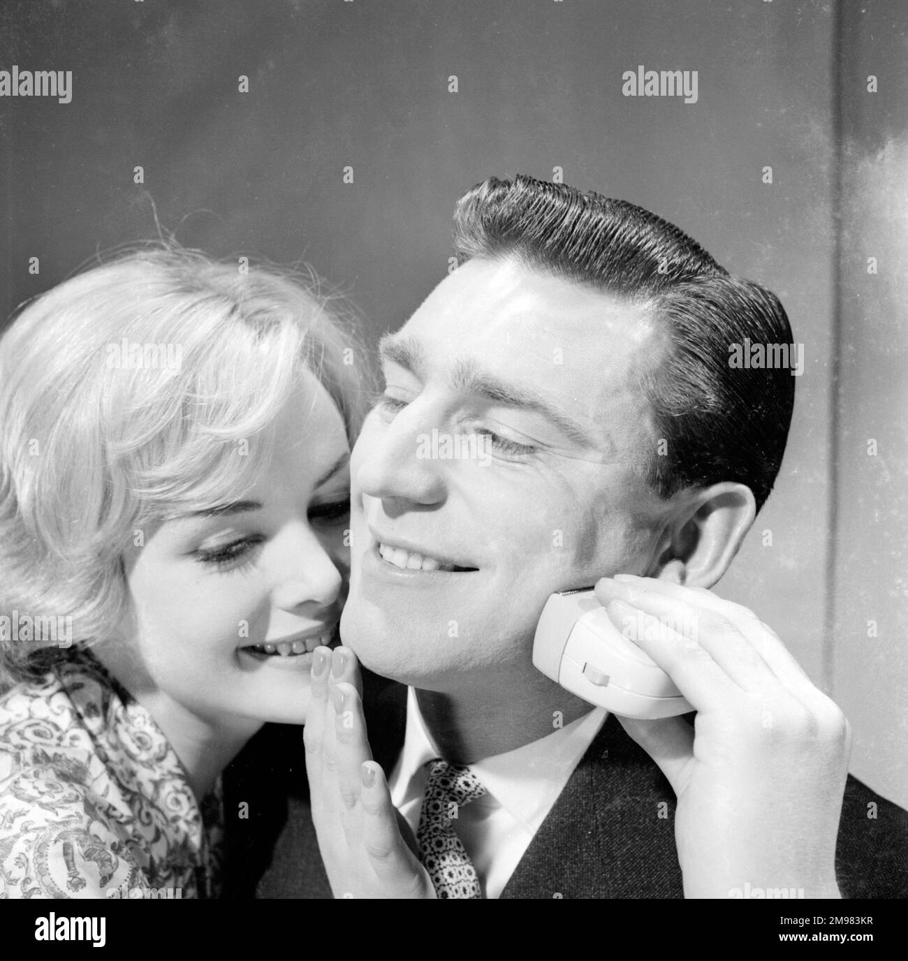 Advertisement for Remington shaver -- male and female models (Sandra ...