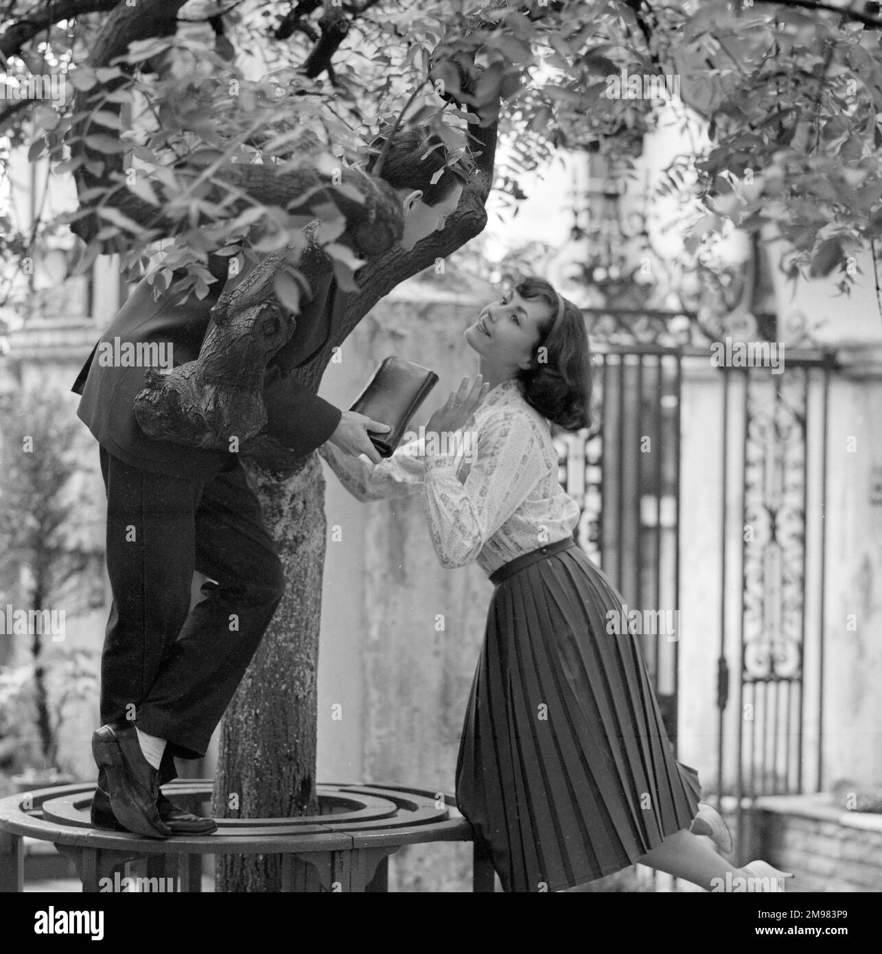 Advertisement for Cadbury's Golden Key -- male and female models (Barry ...
