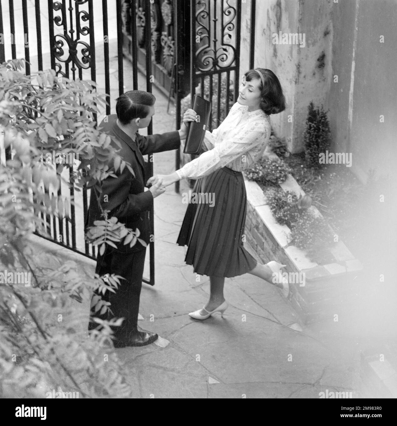 Advertisement for Cadbury's Golden Key -- male and female models (Barry ...