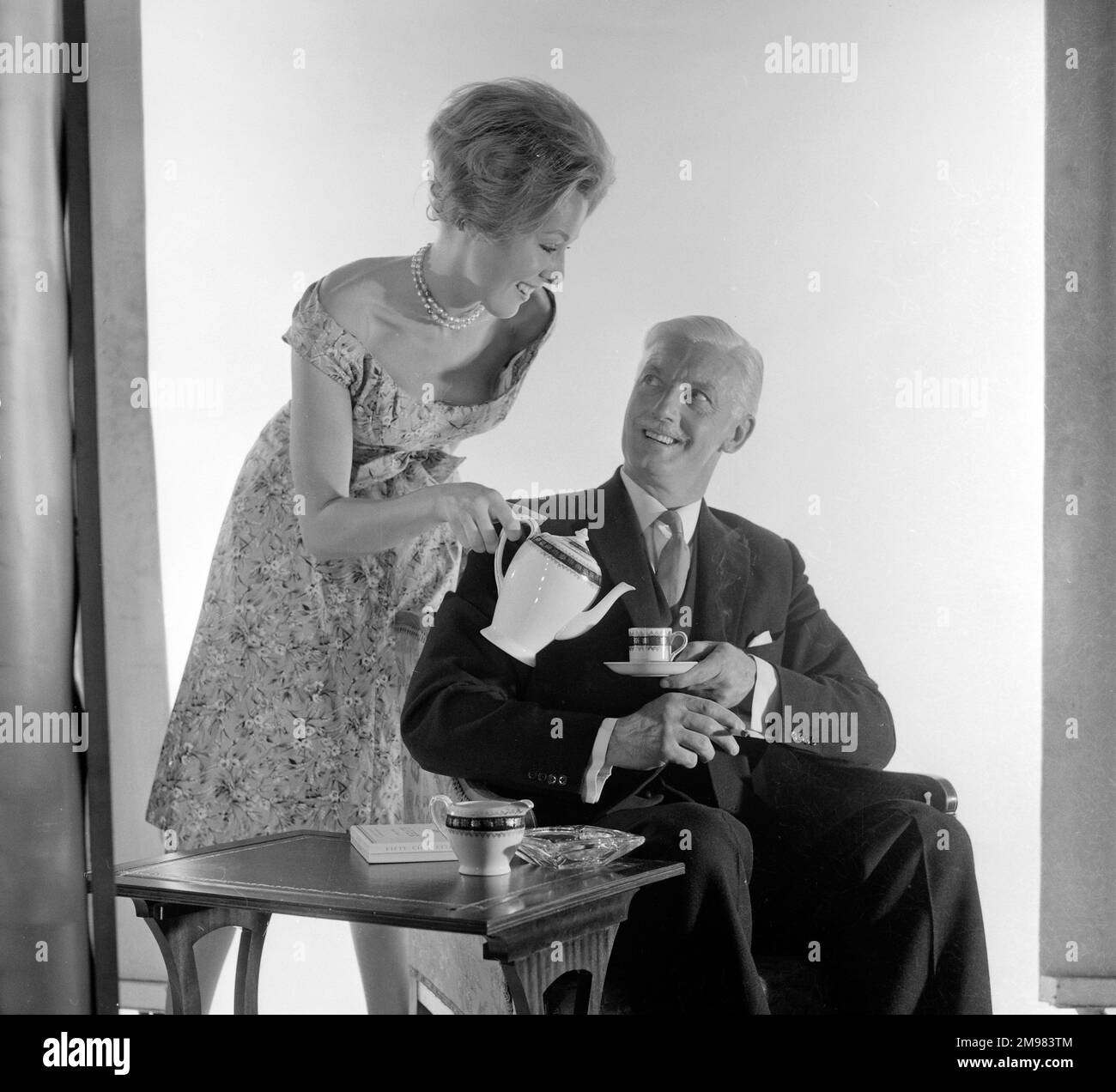 Advertisement for Nescafe -- male and female models posing Stock Photo ...