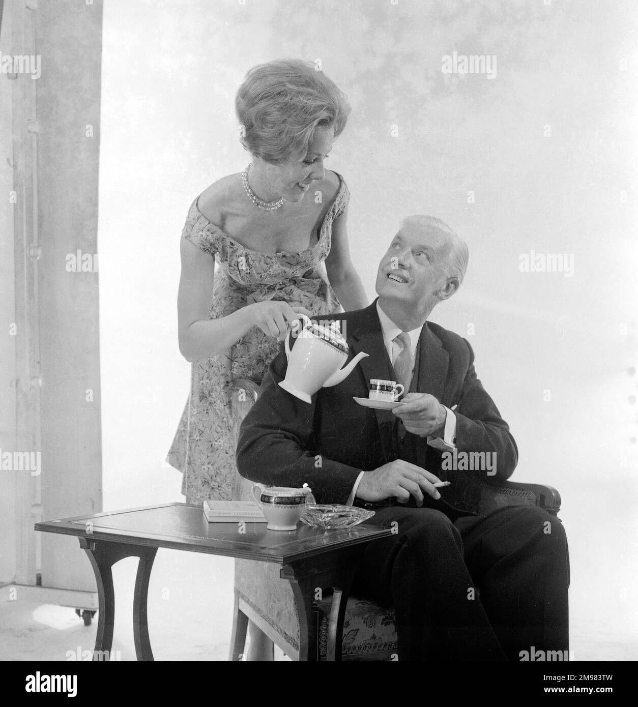 Advertisement for Nescafe -- male and female models posing Stock Photo ...