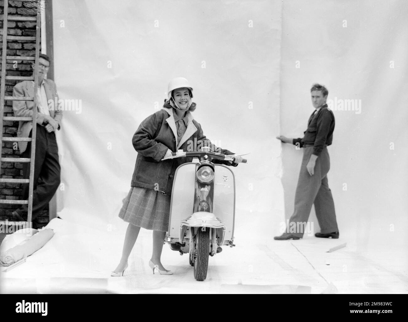 Advertisement for National Benzole petroleum -- female model with motor ...