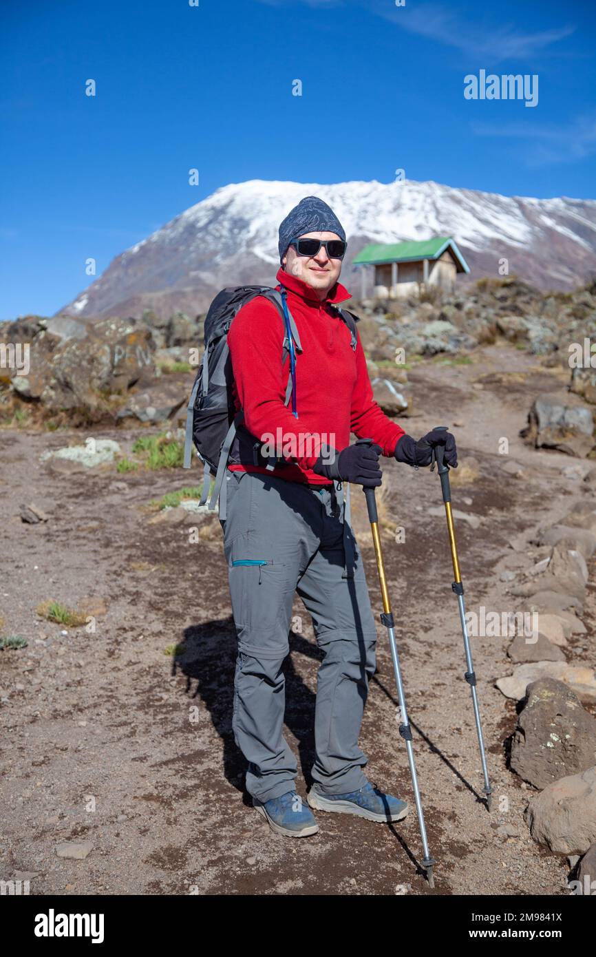 Male backpacker on the trek to Kilimanjaro mountain Stock Photo - Alamy