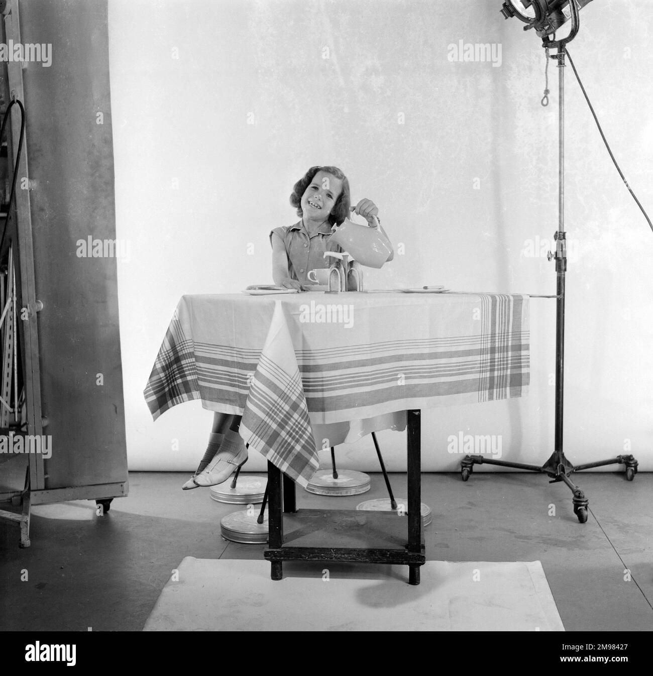 Advertisement for Nescafe -- little girl (Caroline Ellis) sitting at a ...