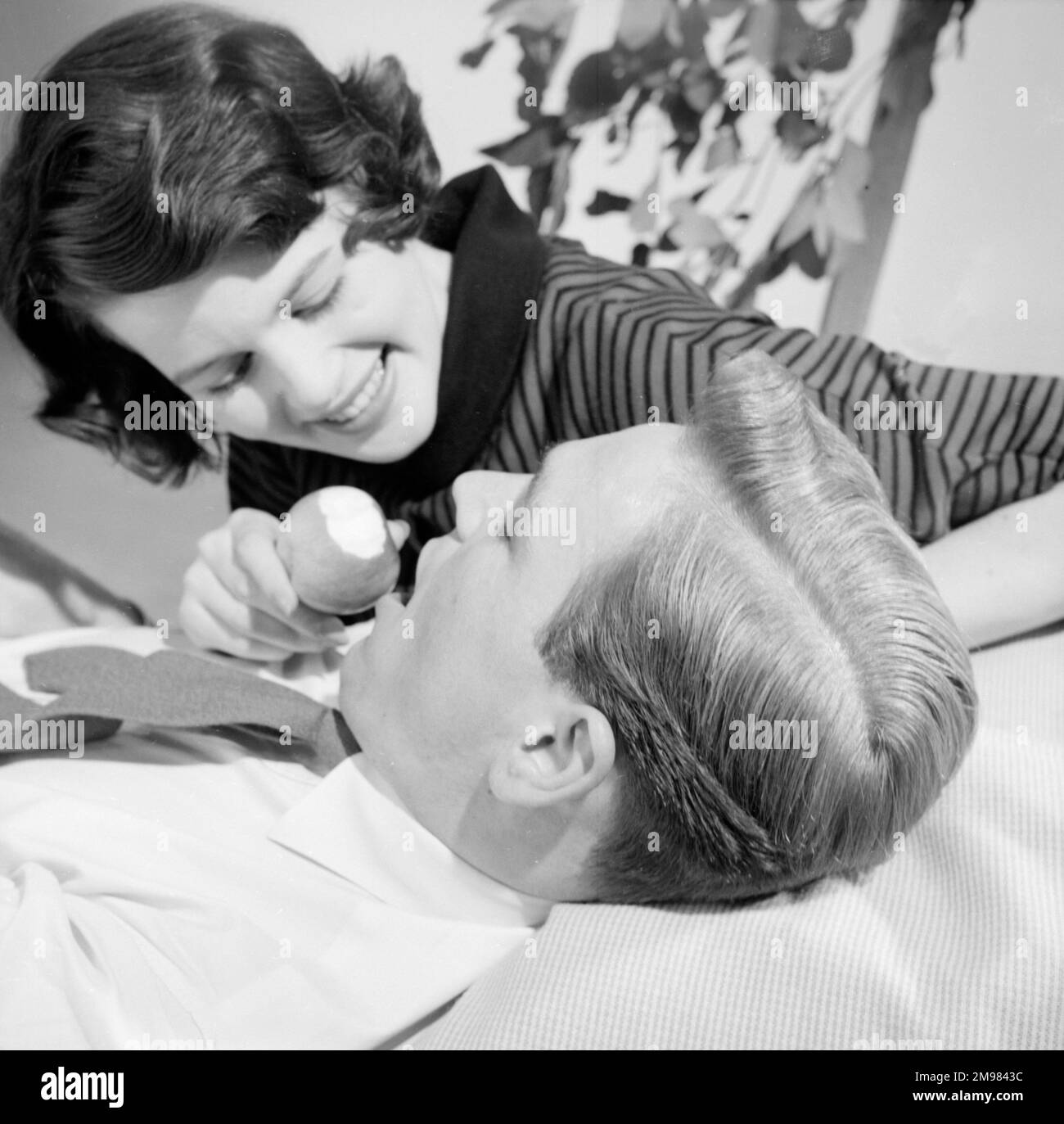 Advertisement for Silvikrin hair products -- male and female models ...