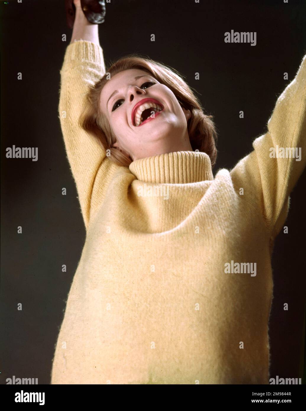 Advertisement for Pepsodent toothpaste -- female model wearing a yellow ...