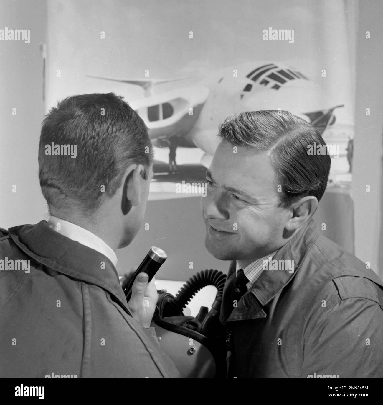 Advertisement for Silvikrin hair products -- two male models posing ...