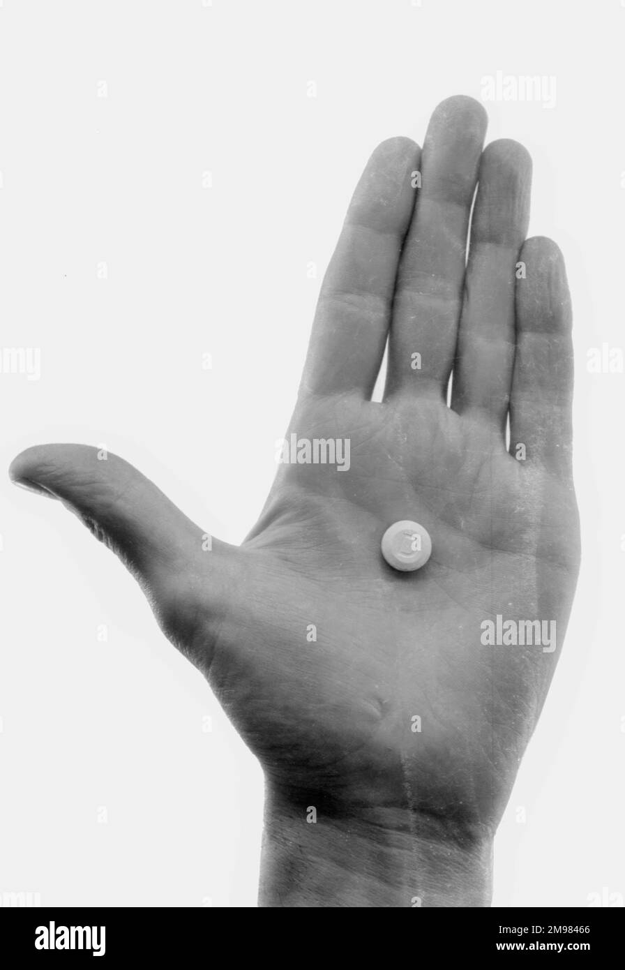 Hand with a pill Black and White Stock Photos & Images - Alamy