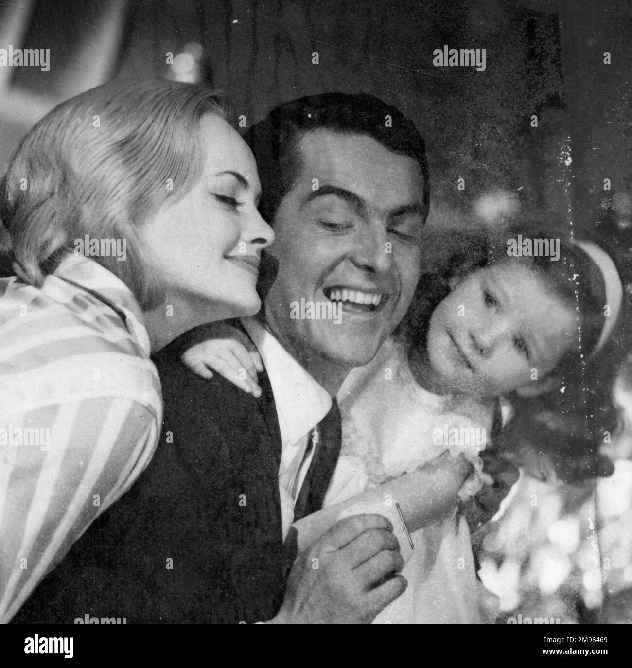 Advertisement for Remington shavers -- three models posing as a happy ...