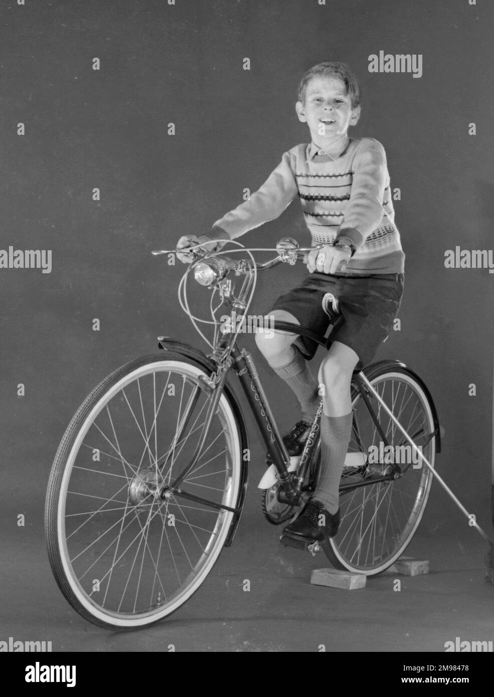 Advertisement for Triumph bicycles -- boy model (David Scully Stock ...