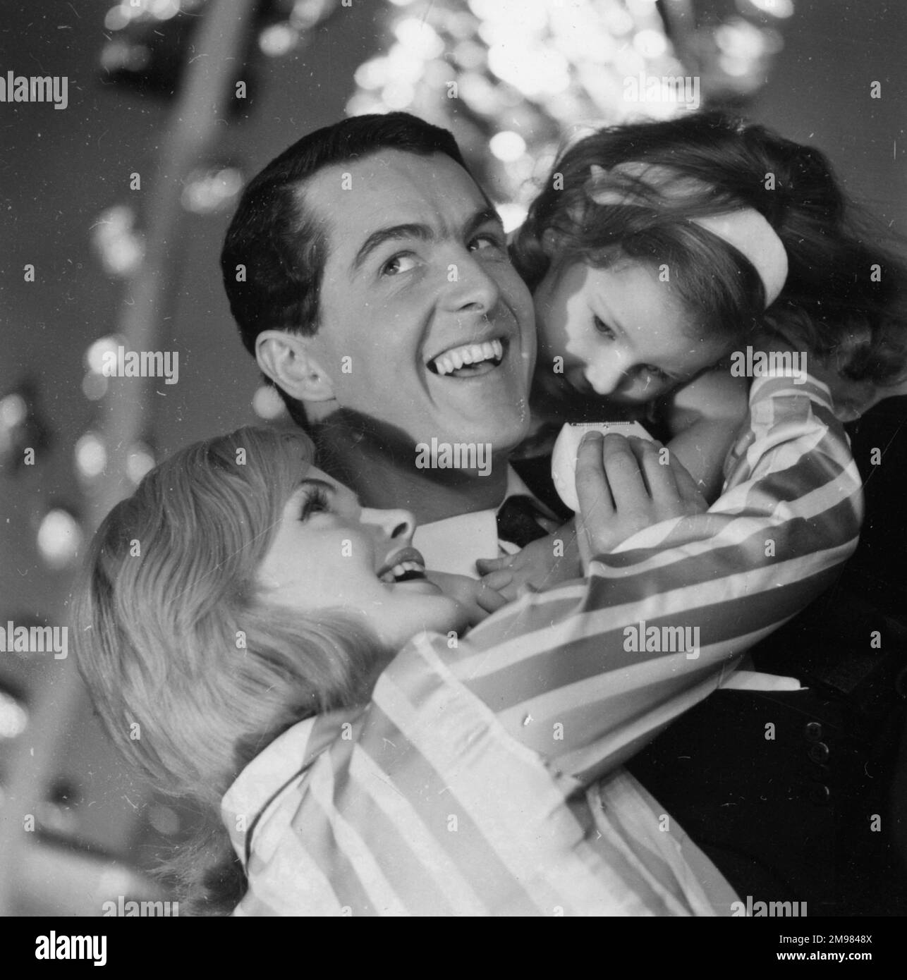 Advertisement for Remington shavers -- three models posing as a happy ...