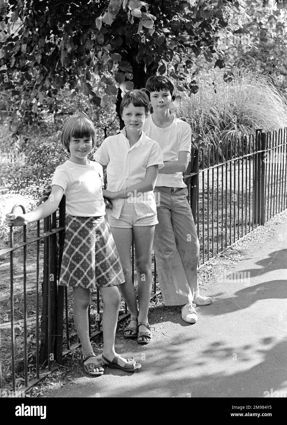Three children, a brother and his two sisters Stock Photo - Alamy