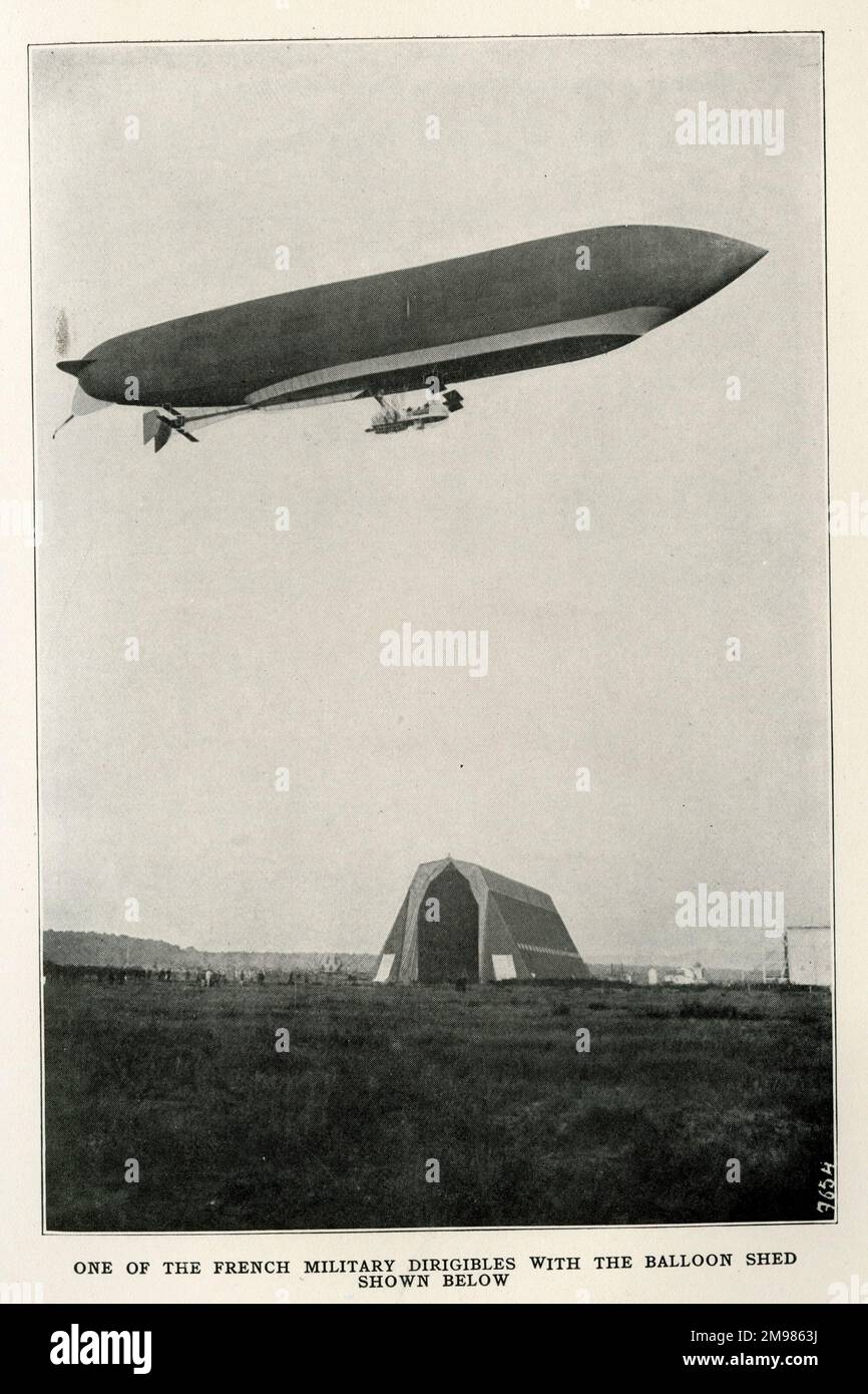 French military dirigible with balloon shed on the ground below Stock ...