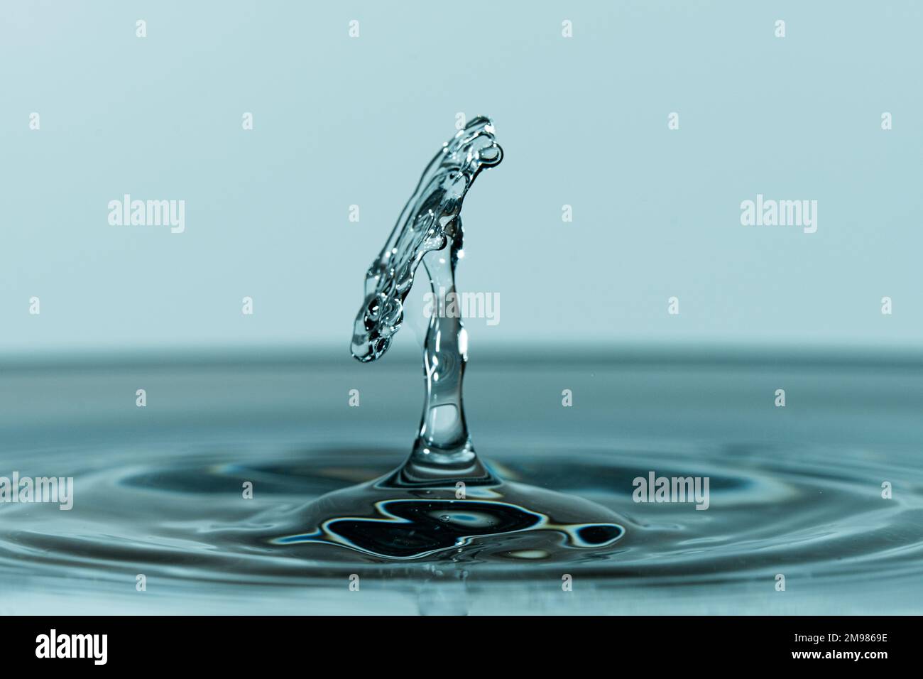 A beautiful colored water drop splash effect background Stock Photo - Alamy