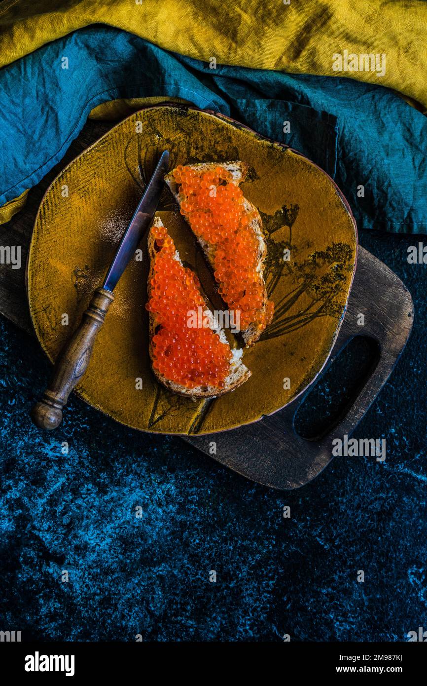 Overhead view of a Slice of toast with red caviar on a plate Stock ...