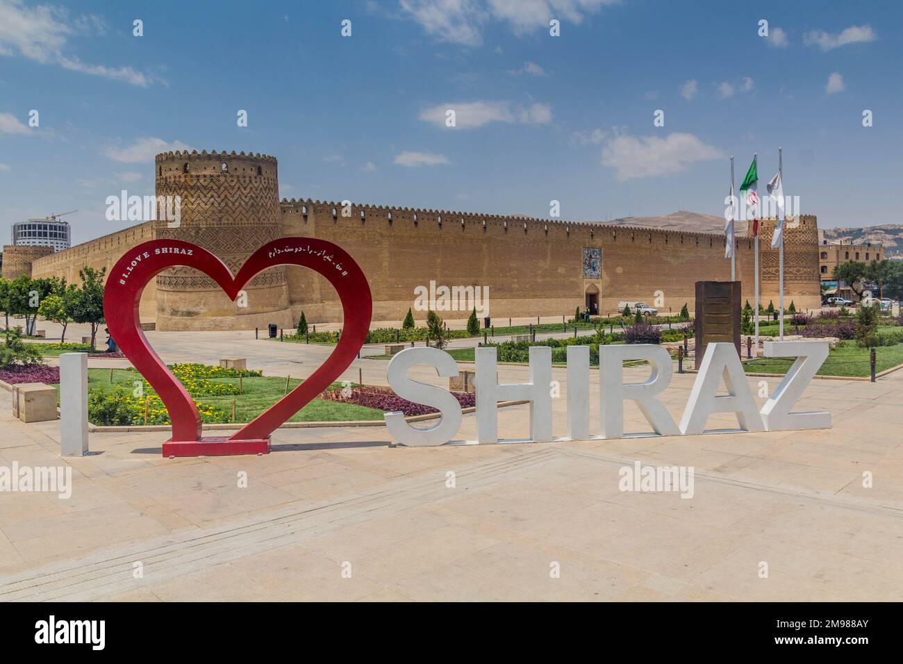 SHIRAZ, IRAN - JULY 6, 2019: I Love Shiraz sign and Karim Khan Citadel ...