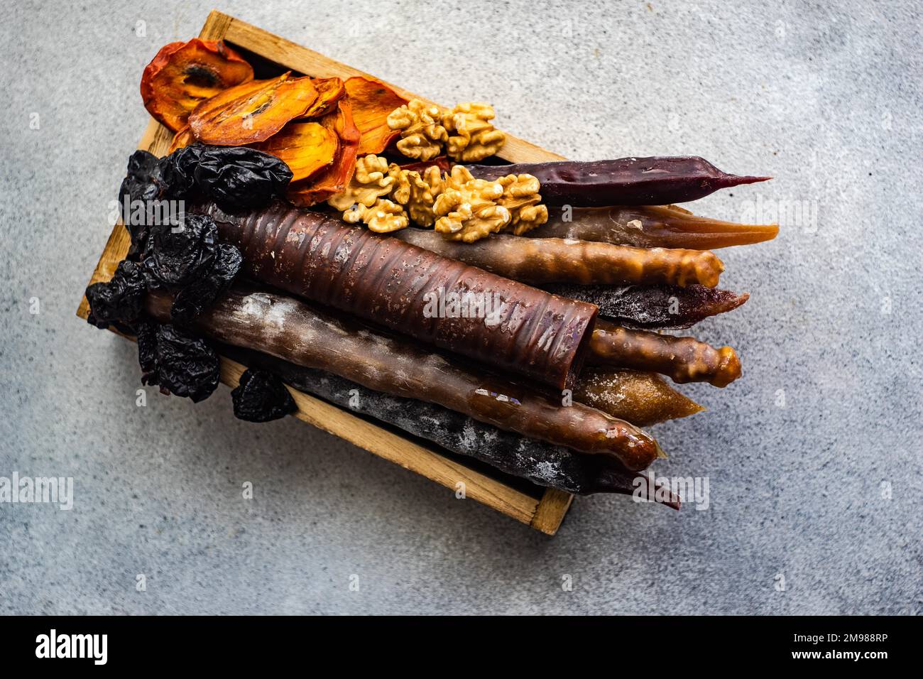 Traditional Georgian churchkhela, tklapi and gozinaki with assorted ...
