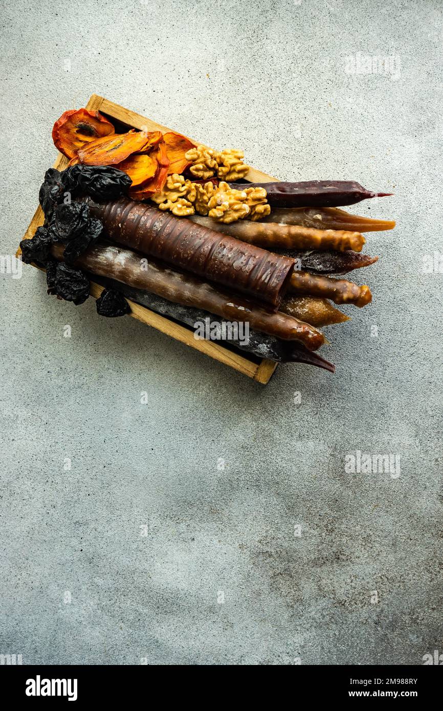 Traditional Georgian churchkhela, tklapi and gozinaki with assorted ...